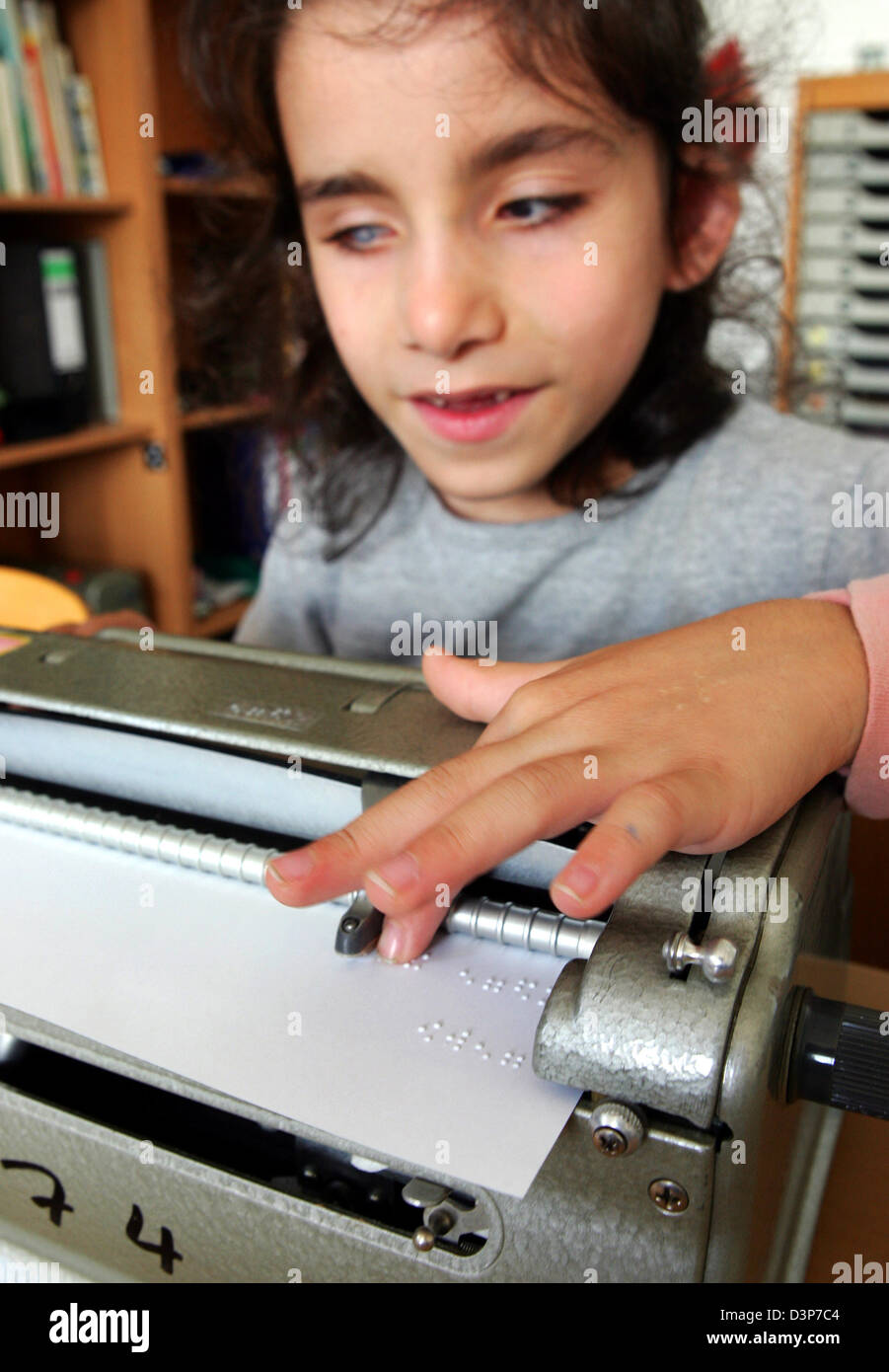 (dpa file) - A blind students writes braille with a braille machine in ...
