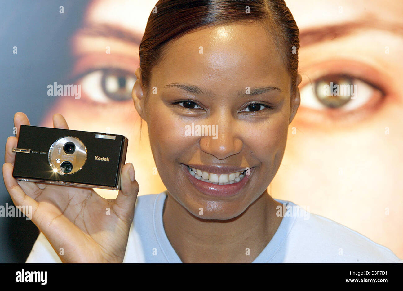 A model presents a digital camera 'Kodak Easy Share V705' at the trade ...