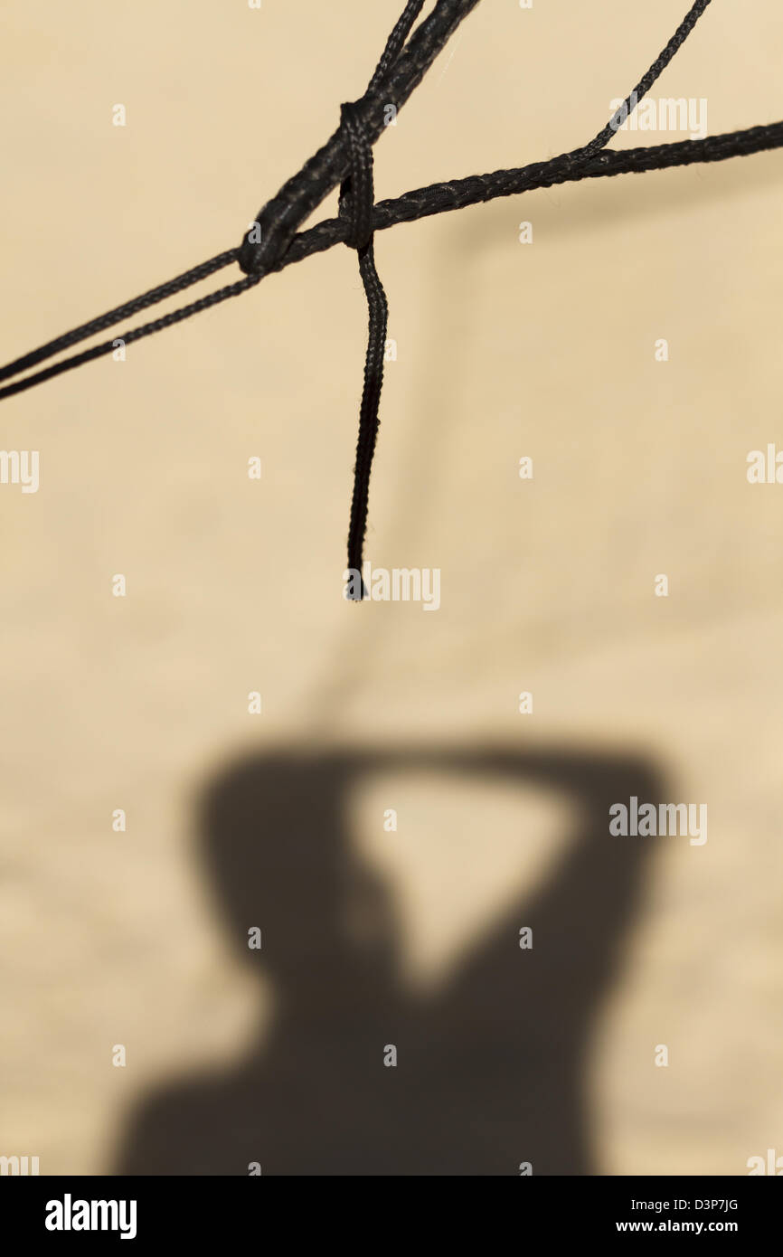 Tangled string with shadow of photographer Stock Photo - Alamy