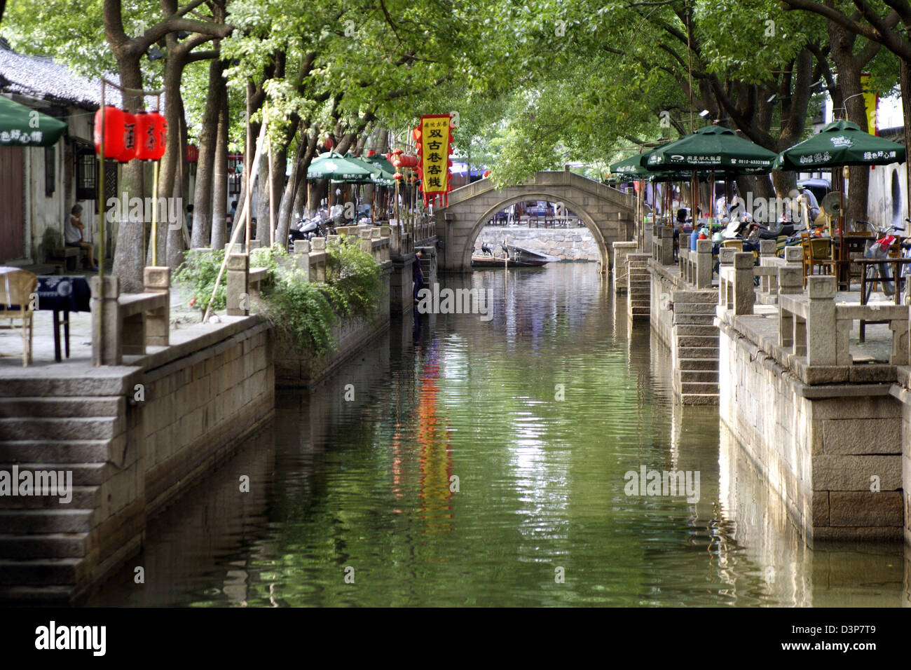 The photo shows one of the typical canals and a bridge in Tongli, China ...