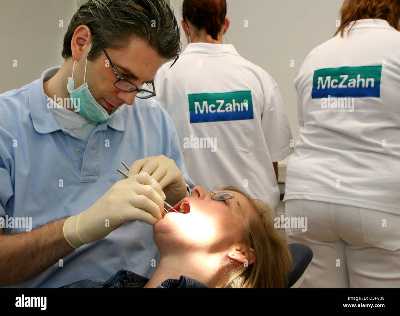 Dentist Oliver Desch examines a patient at Germany's first discount ...