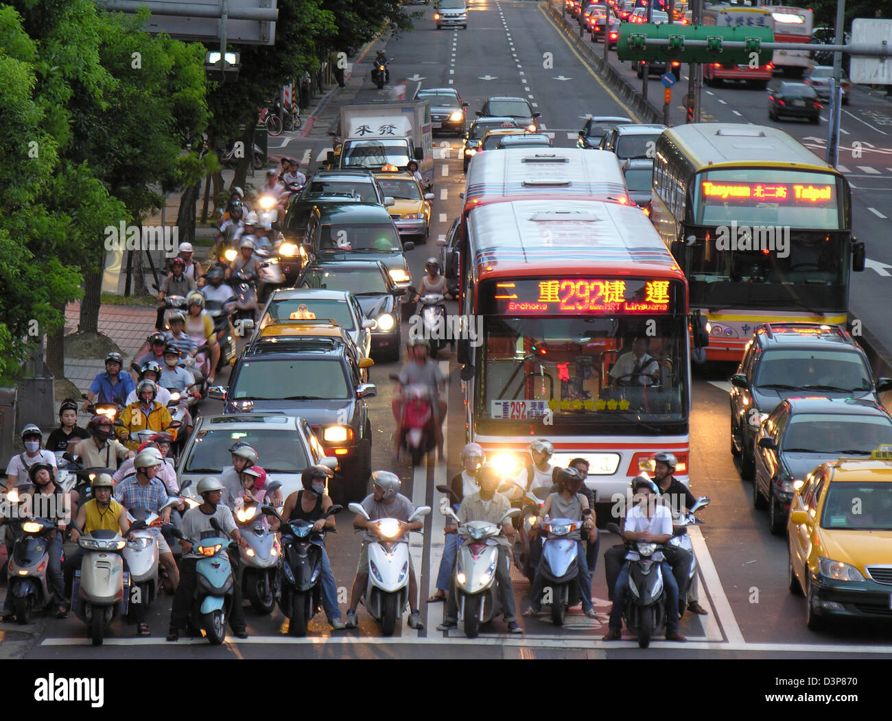 Vehicles cue at a traffic light during the rush hour of Taipei, Taiwan ...