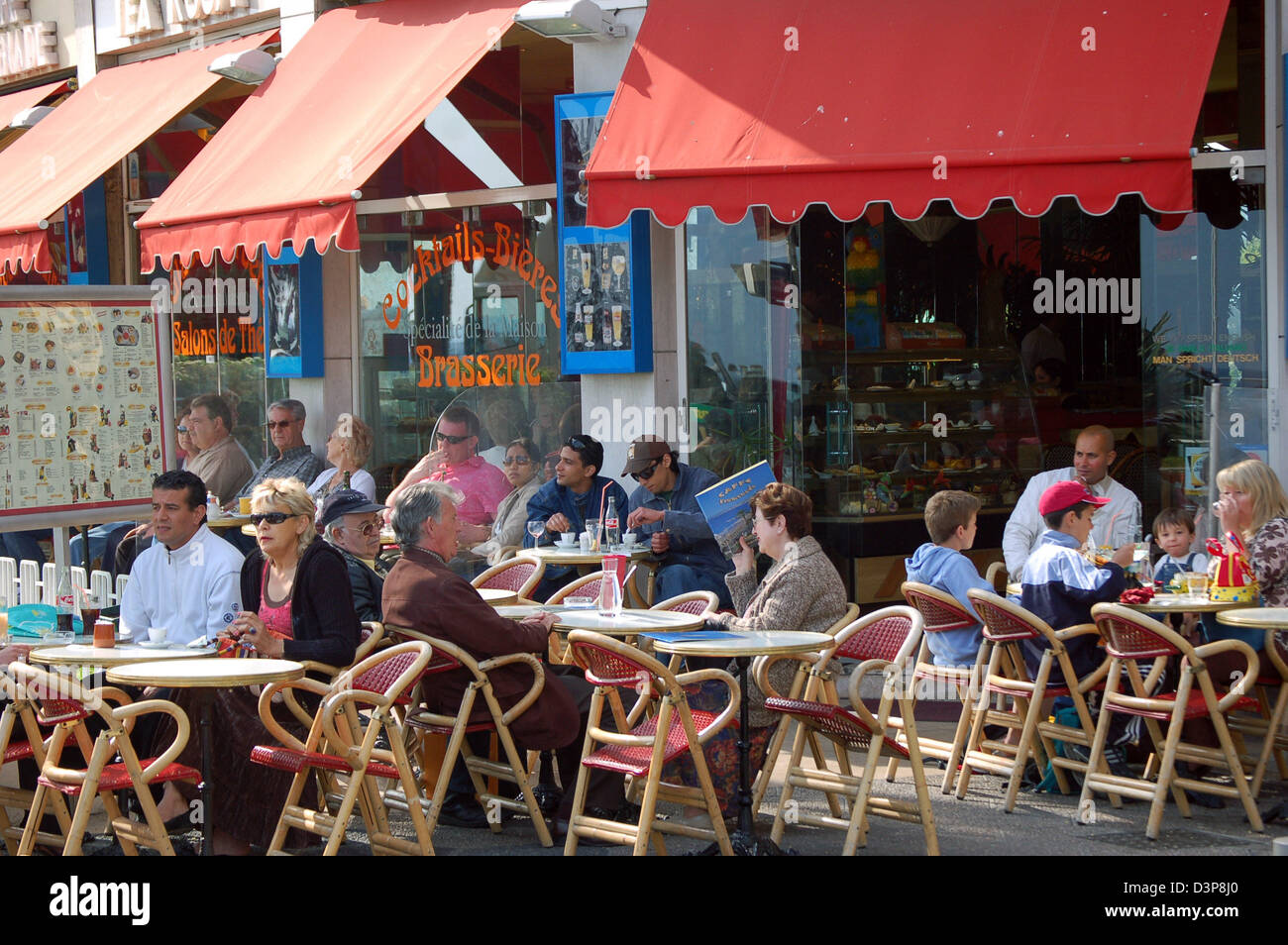 The photo shows a street cafe on the 'Promenade des Anglais' in Nice ...