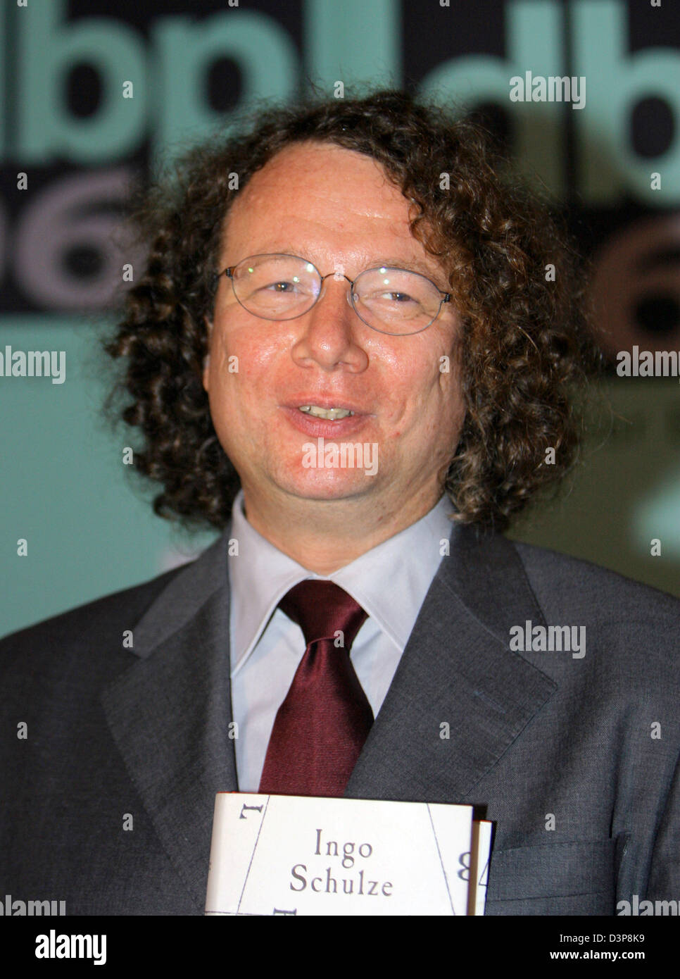 German author Ingo Schulze poses with his book at a photocall to the ...