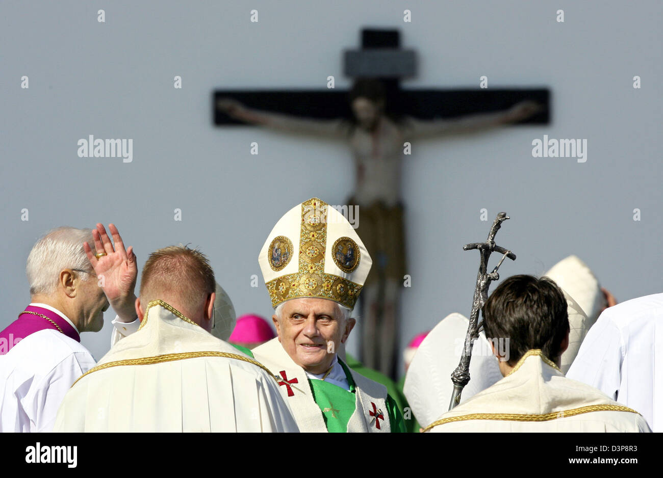 Pope Benedict XVI waves from the altar stage during his open air ...