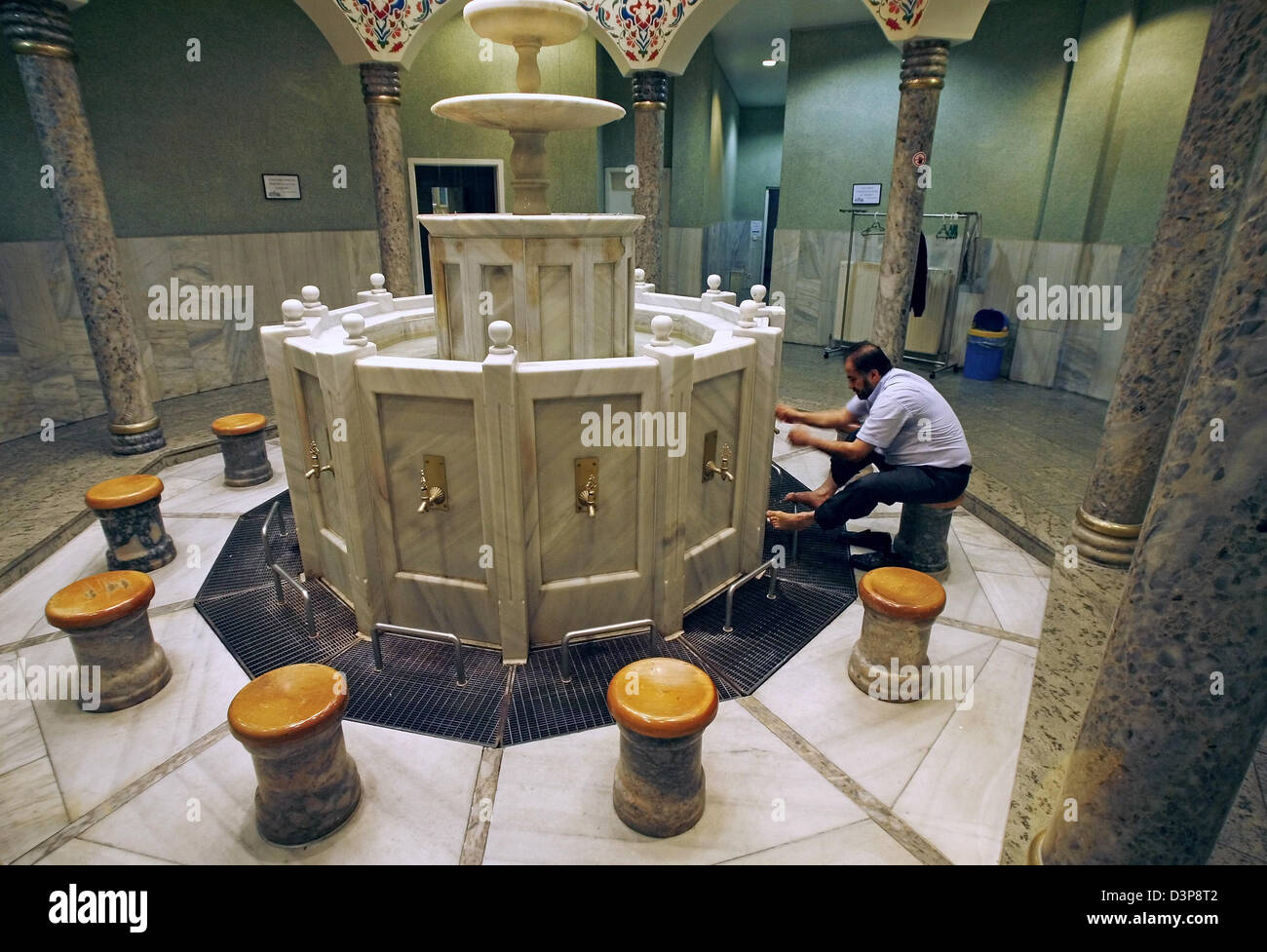 A man washes himself at a washing room of the the Yavuz-Sultan-Selim ...