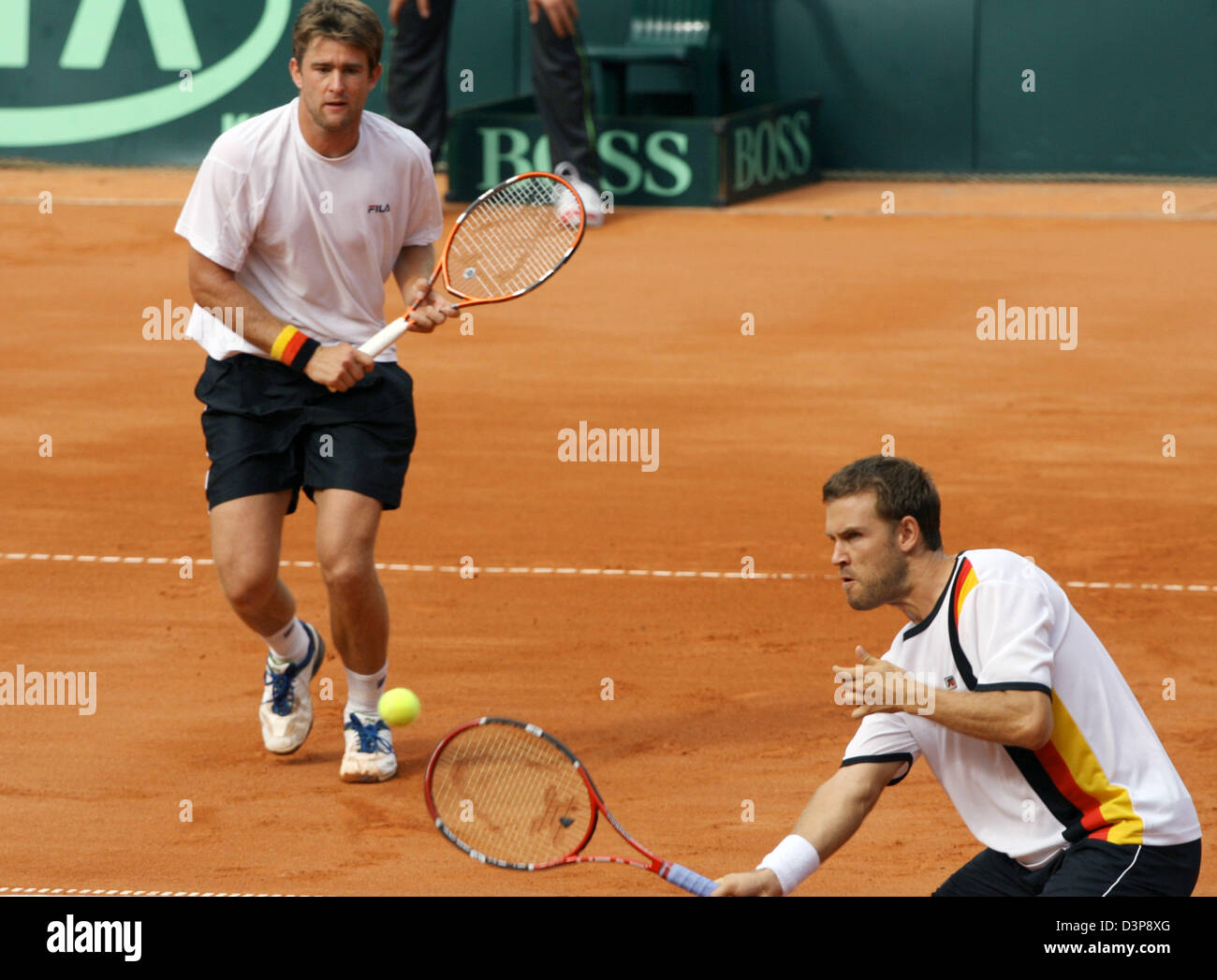 German tennis pros Alexander Waske (R) and Michael Kohlmann return a ...
