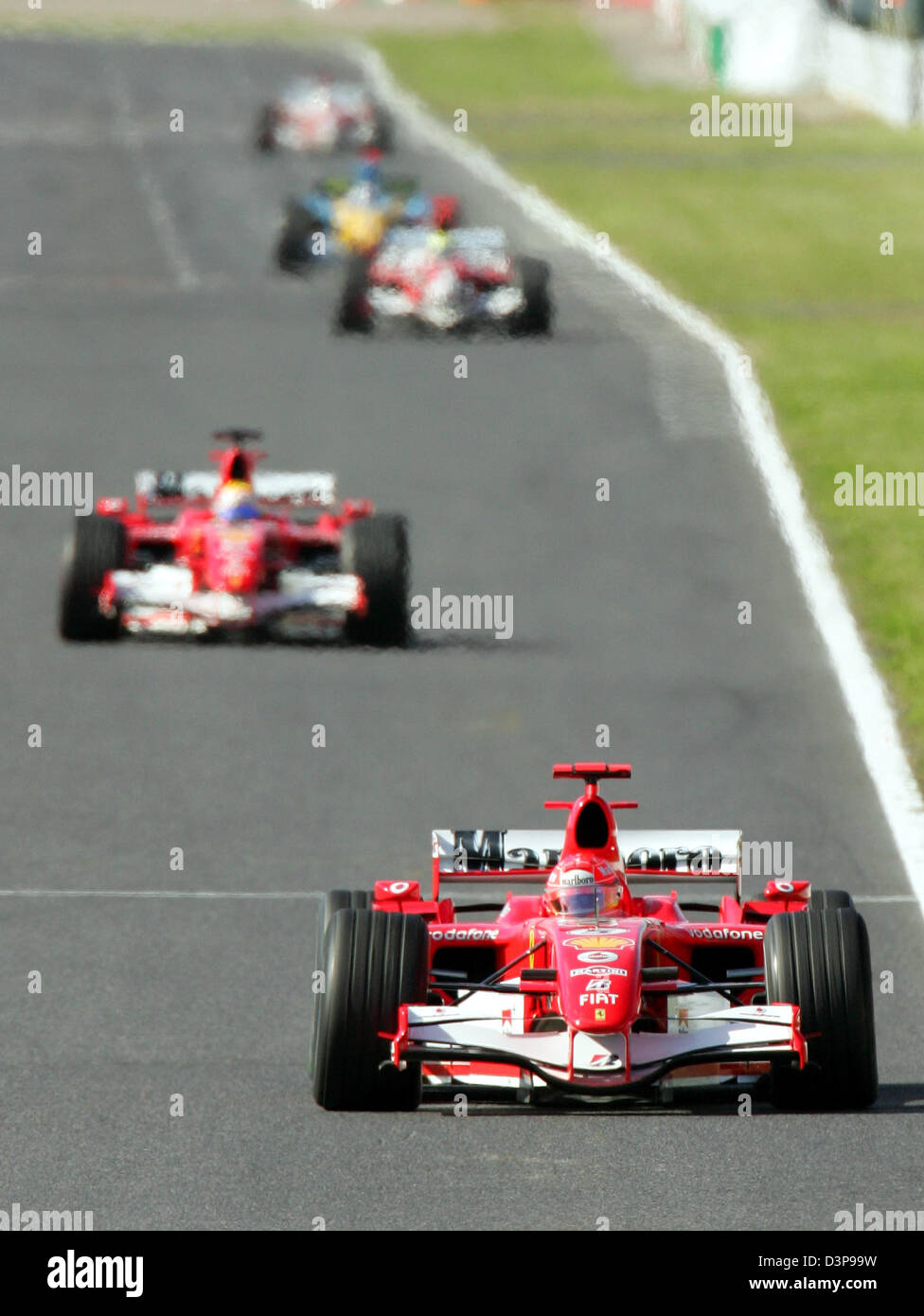 German Formula One driver Michael Schumacher leads the pack ahead of ...