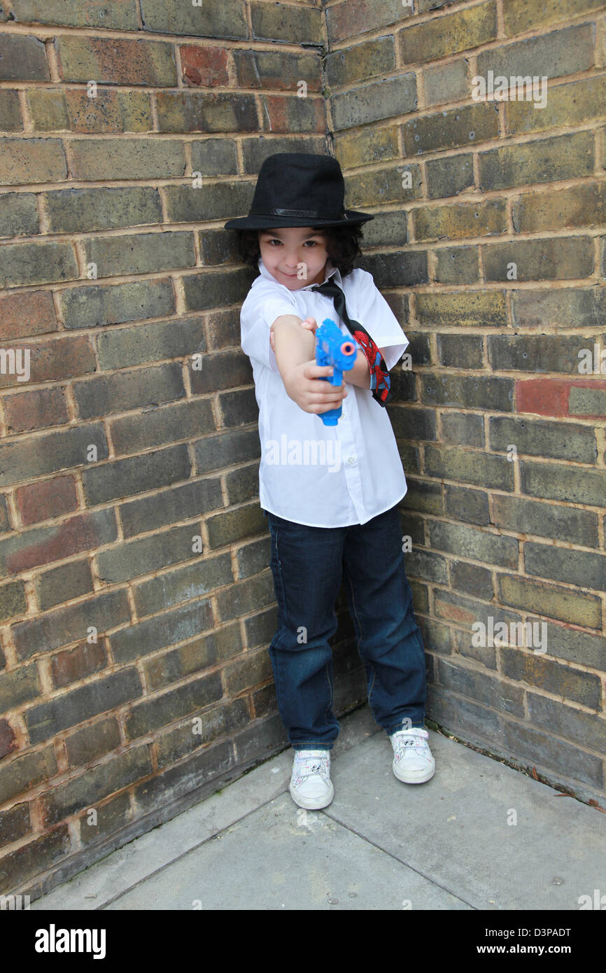 Boy shooting water pistol hi-res stock photography and images - Alamy