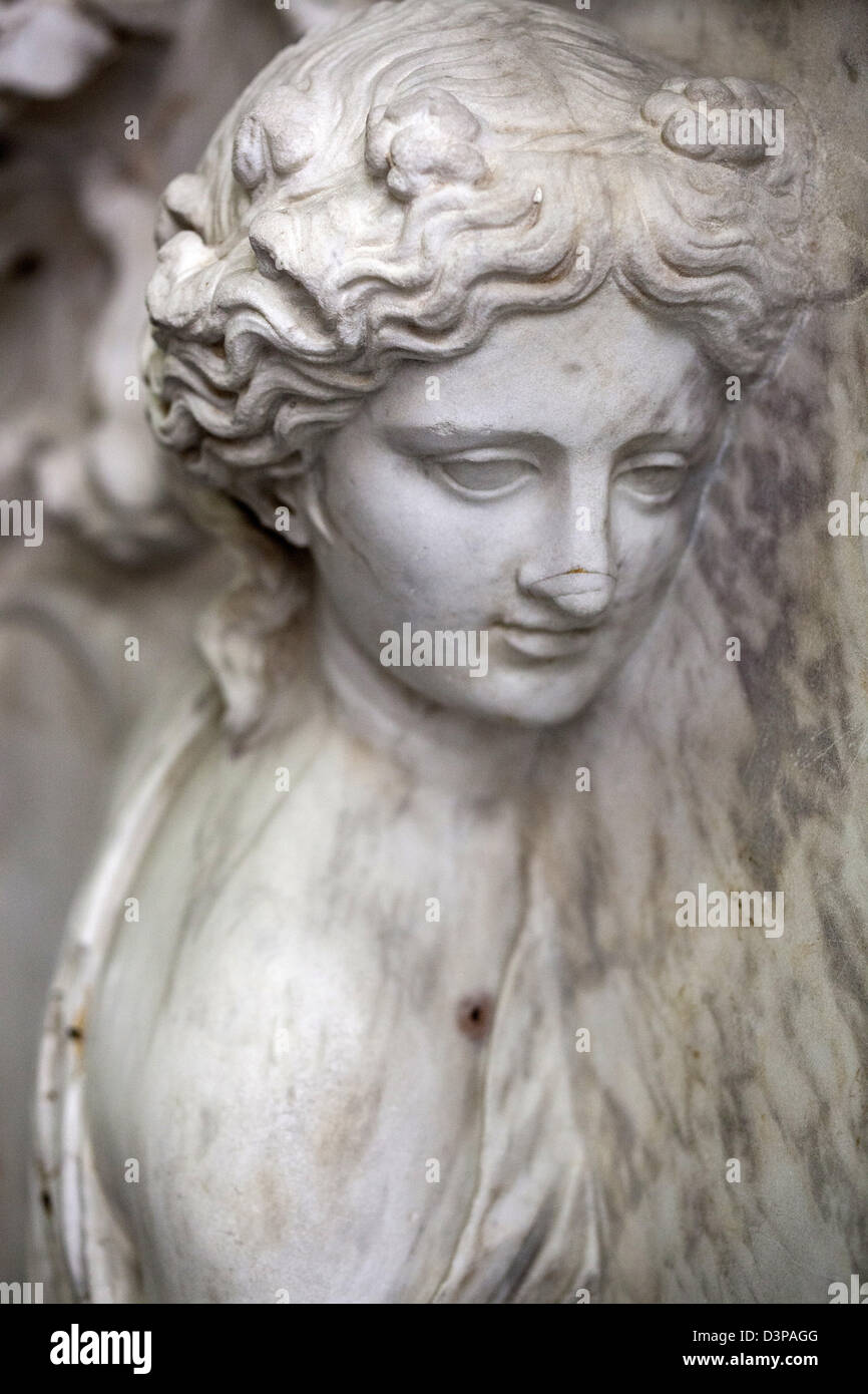 Detail of a female face on an ancient relief sculpture in the Vatican ...
