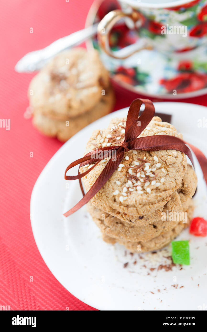 stack of cookies and a cup of tea, sweets closeup Stock Photo - Alamy