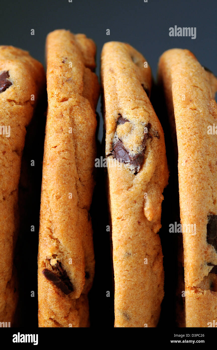 Closeup of chocolate chip cookies standing on their sides Stock Photo ...