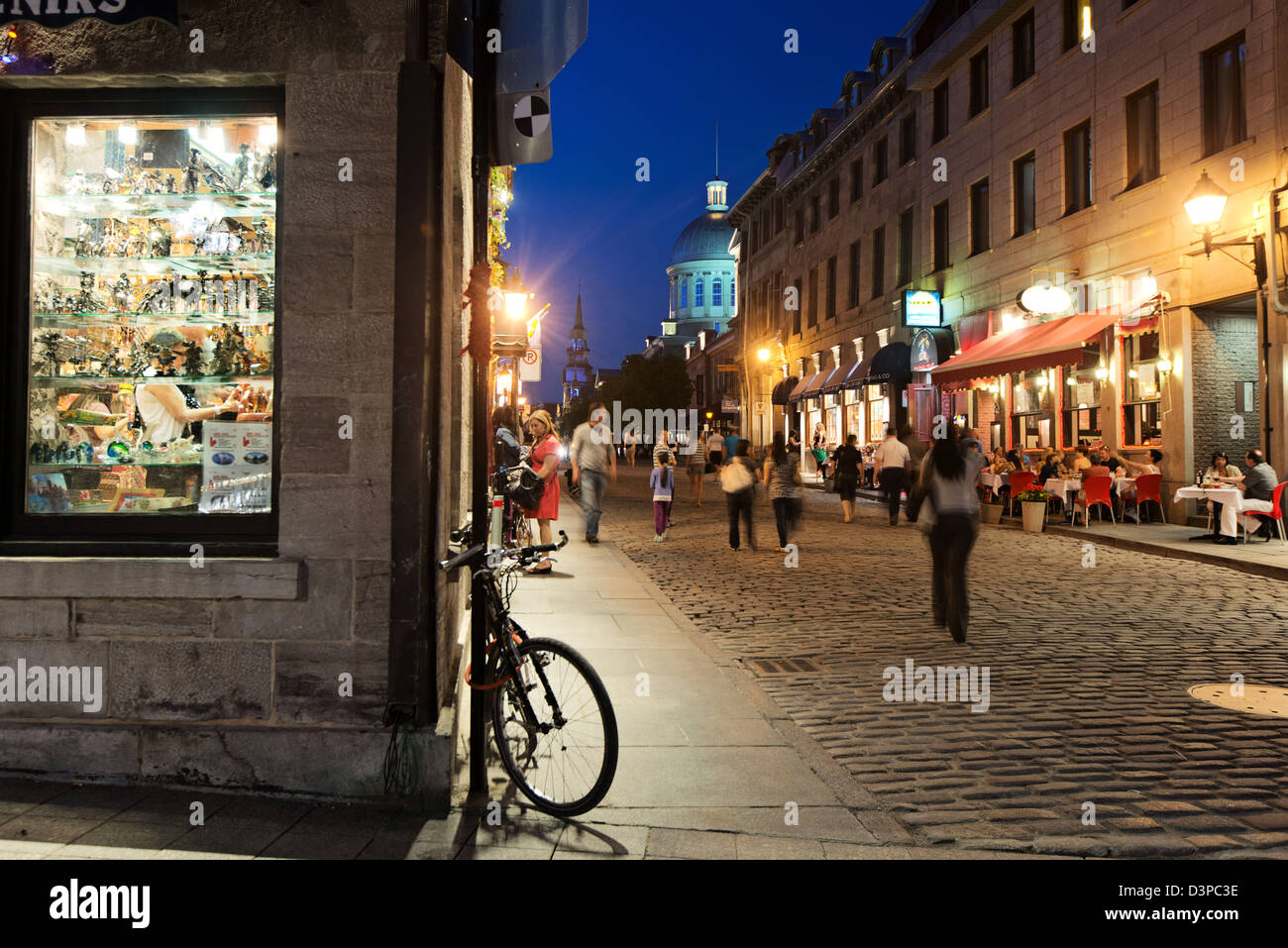 Tourists enjoying Rue Saint Paul Street in district of Old Montreal ...
