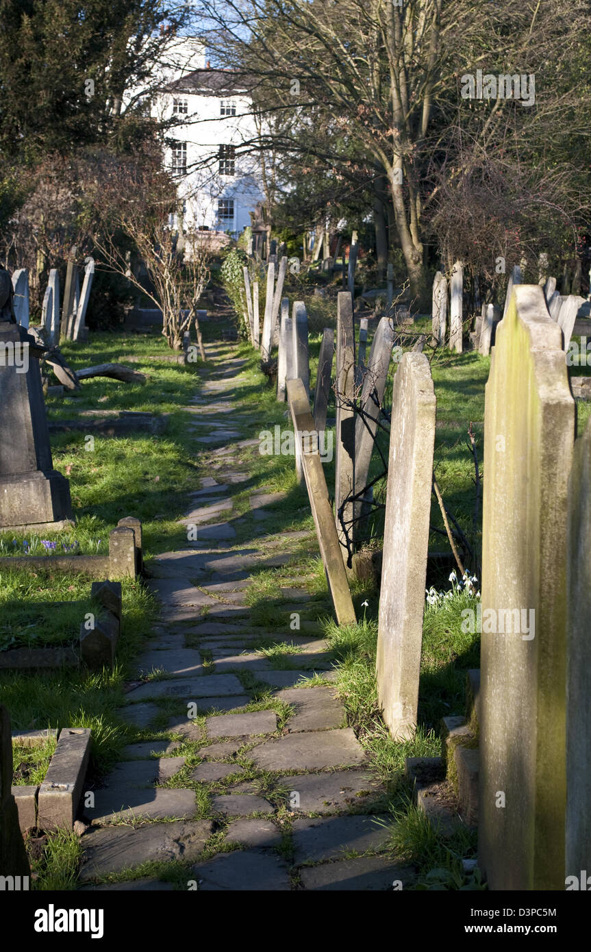 Old graveyard with a residential house at bottom of the path, Hampstead ...