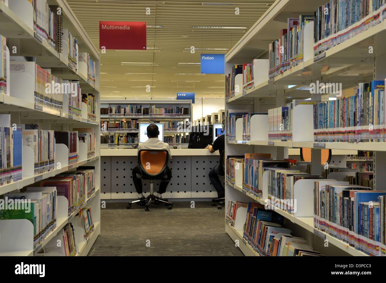 Working on computer at public library: Singapore Stock Photo - Alamy