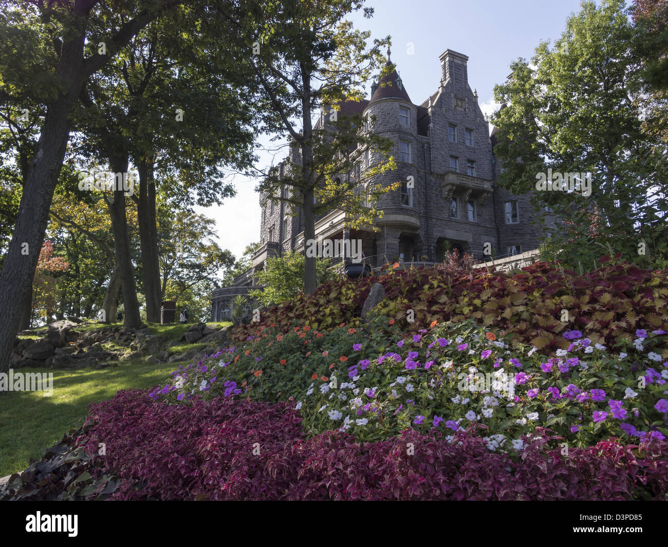 Flowers and a Castle. A flowing bed of flowers leads up to the imposing ...