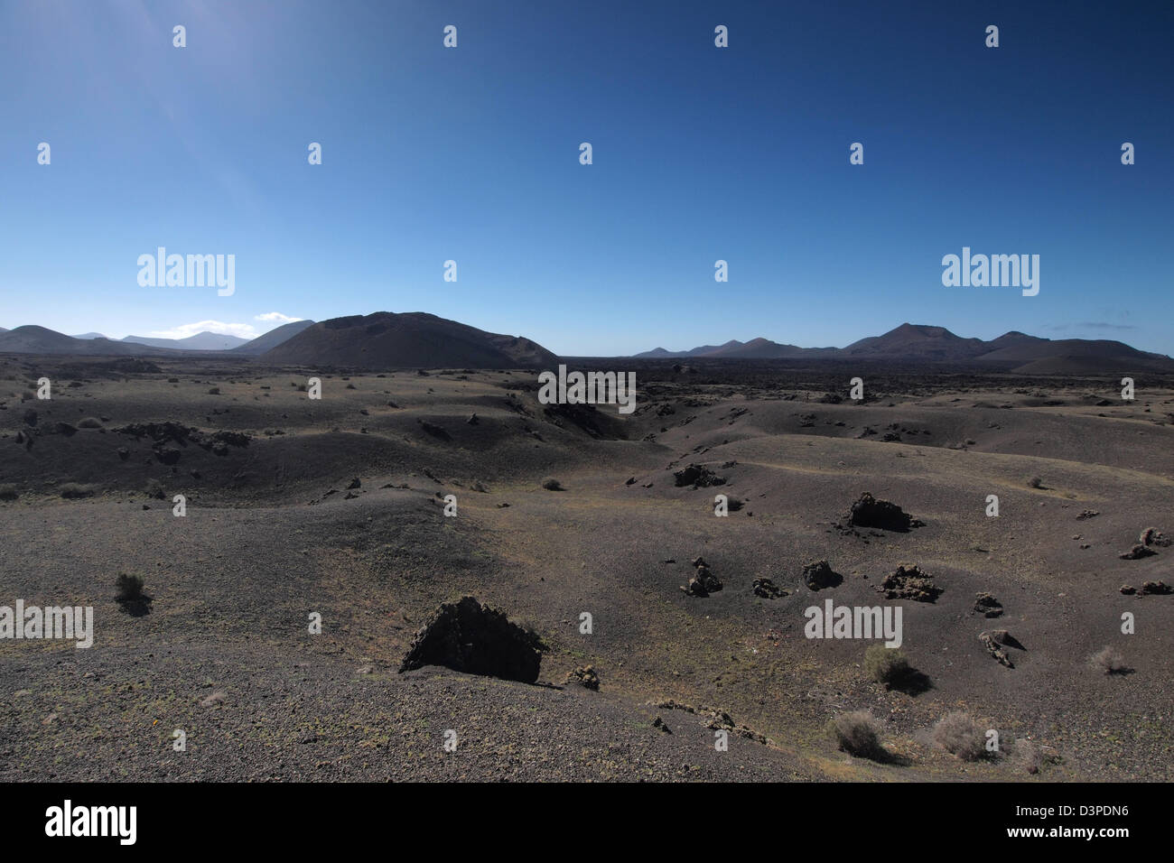 old dried lava flow fields in timanfaya, lanzarote spain Stock Photo ...