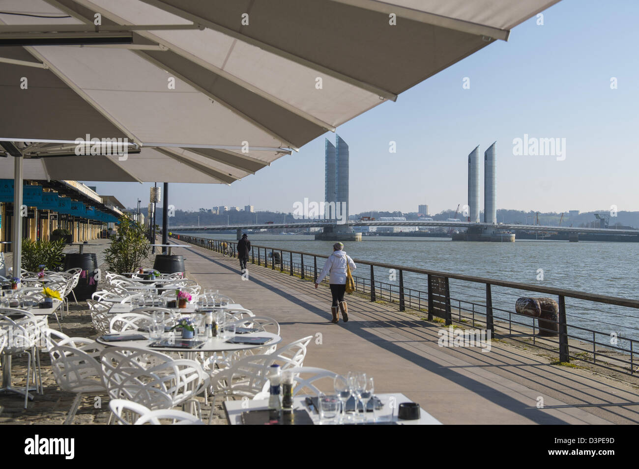 Cafe tables on the Quai de Bacalan with the Chaban-Delmas Lift Bridge ...