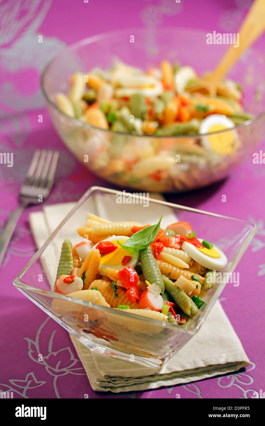 Pasta shells salad with basil. Recipe available Stock Photo - Alamy