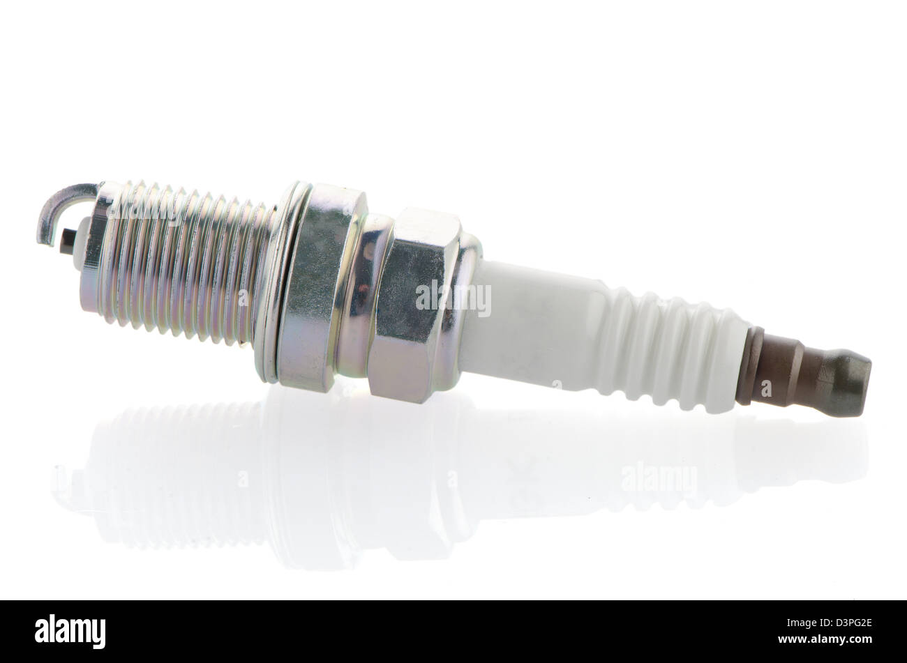 Spark-plug on white reflective background Stock Photo - Alamy
