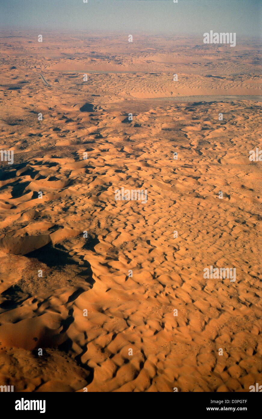 Aerial view of the massive red dunes and sabkha flats near the Shaybah ...