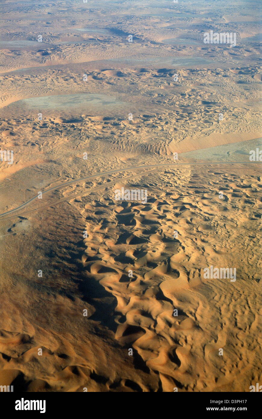 Aerial view of the massive red dunes and sabkha flats near the Shaybah ...
