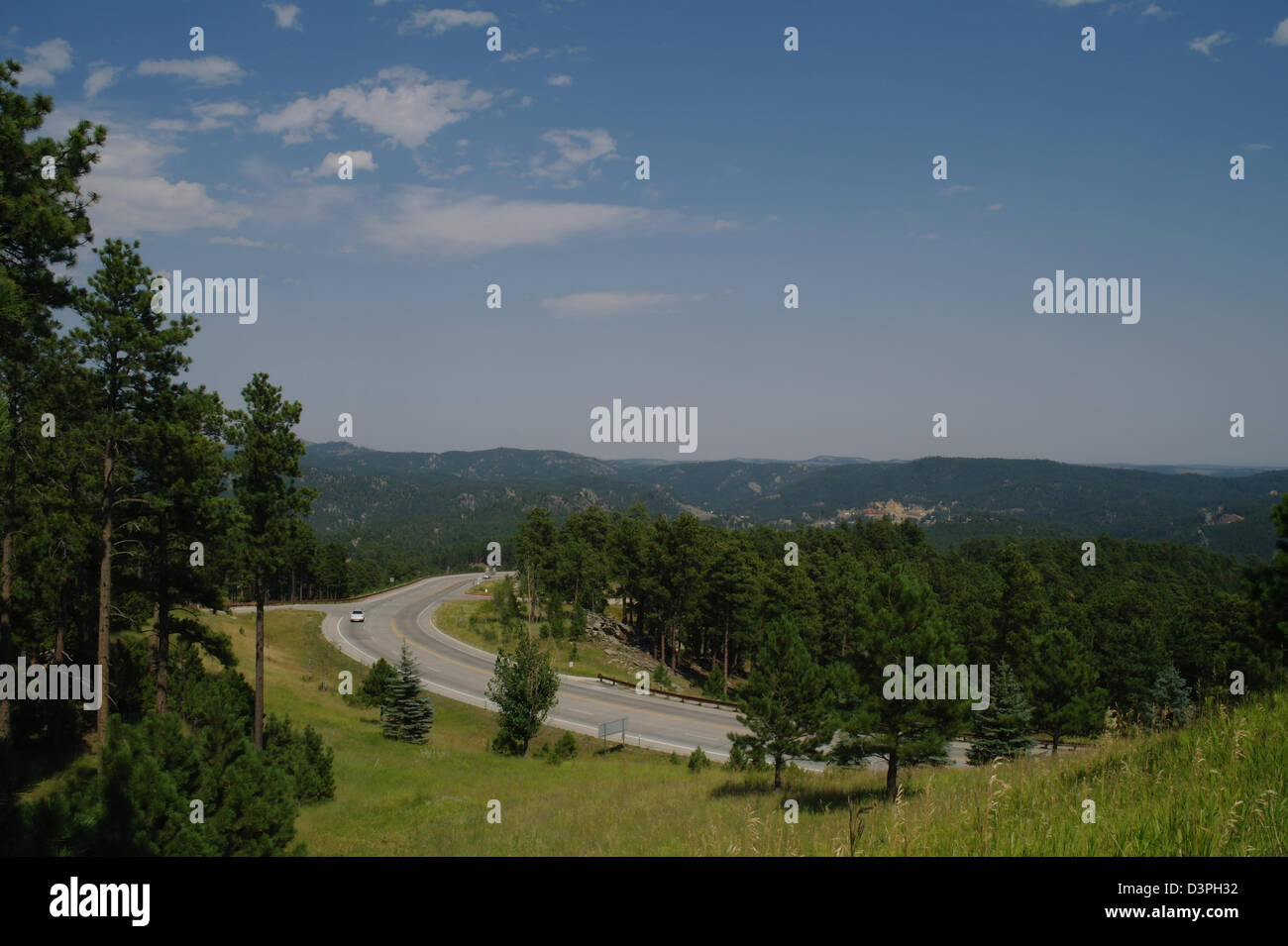 Blue sky view Highway 244 and pine trees hills from the car-park at the ...