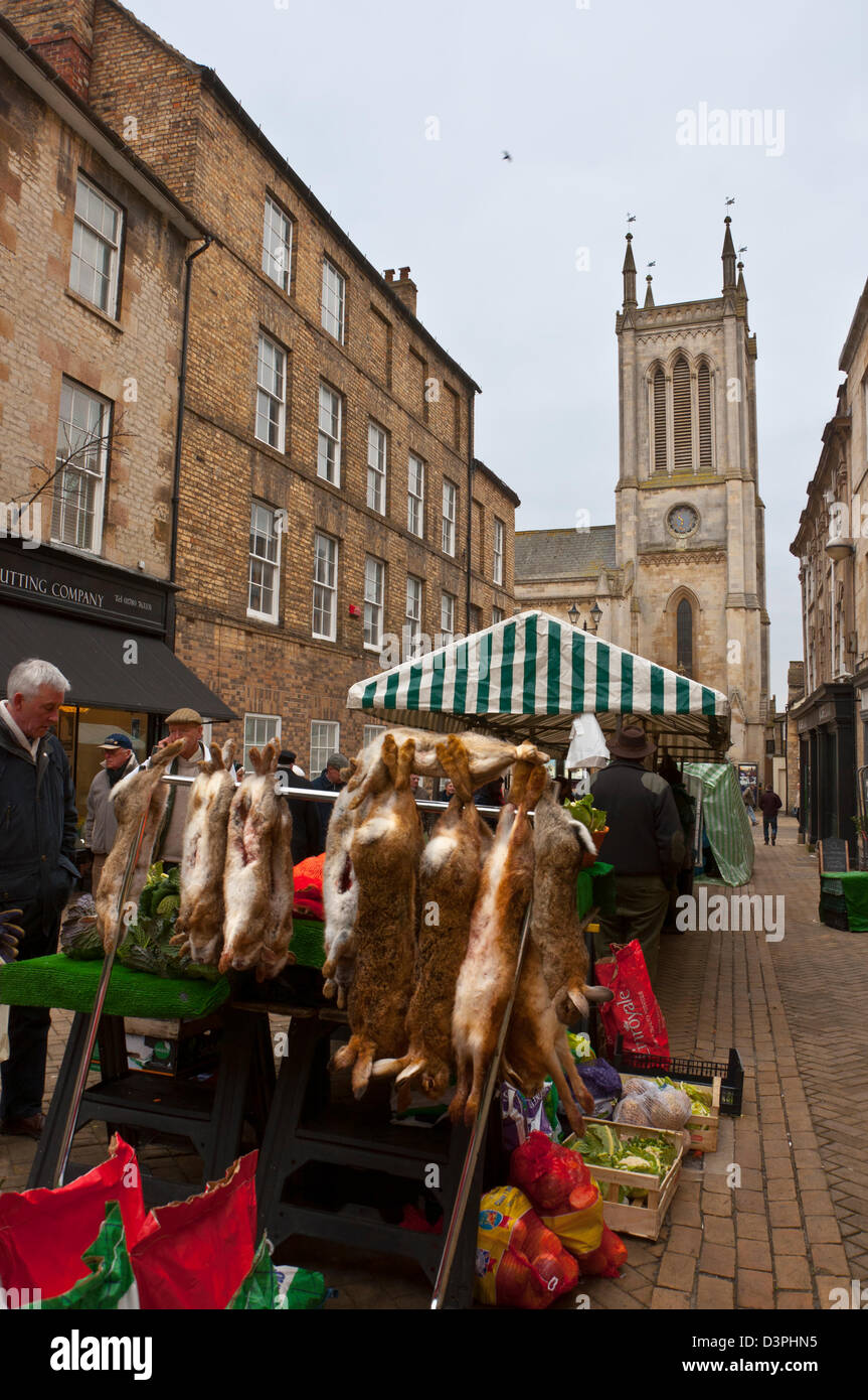 Rabbit and hare for sale on market stall Traditional street market ...