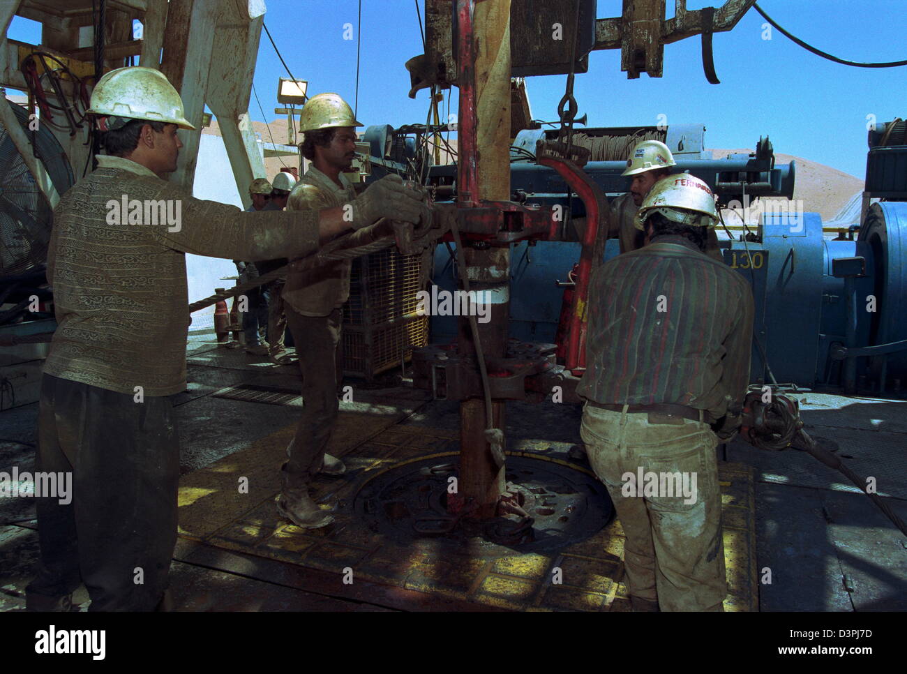 Action on the rig floor of an oil and gas exploration rig in the Saudi ...