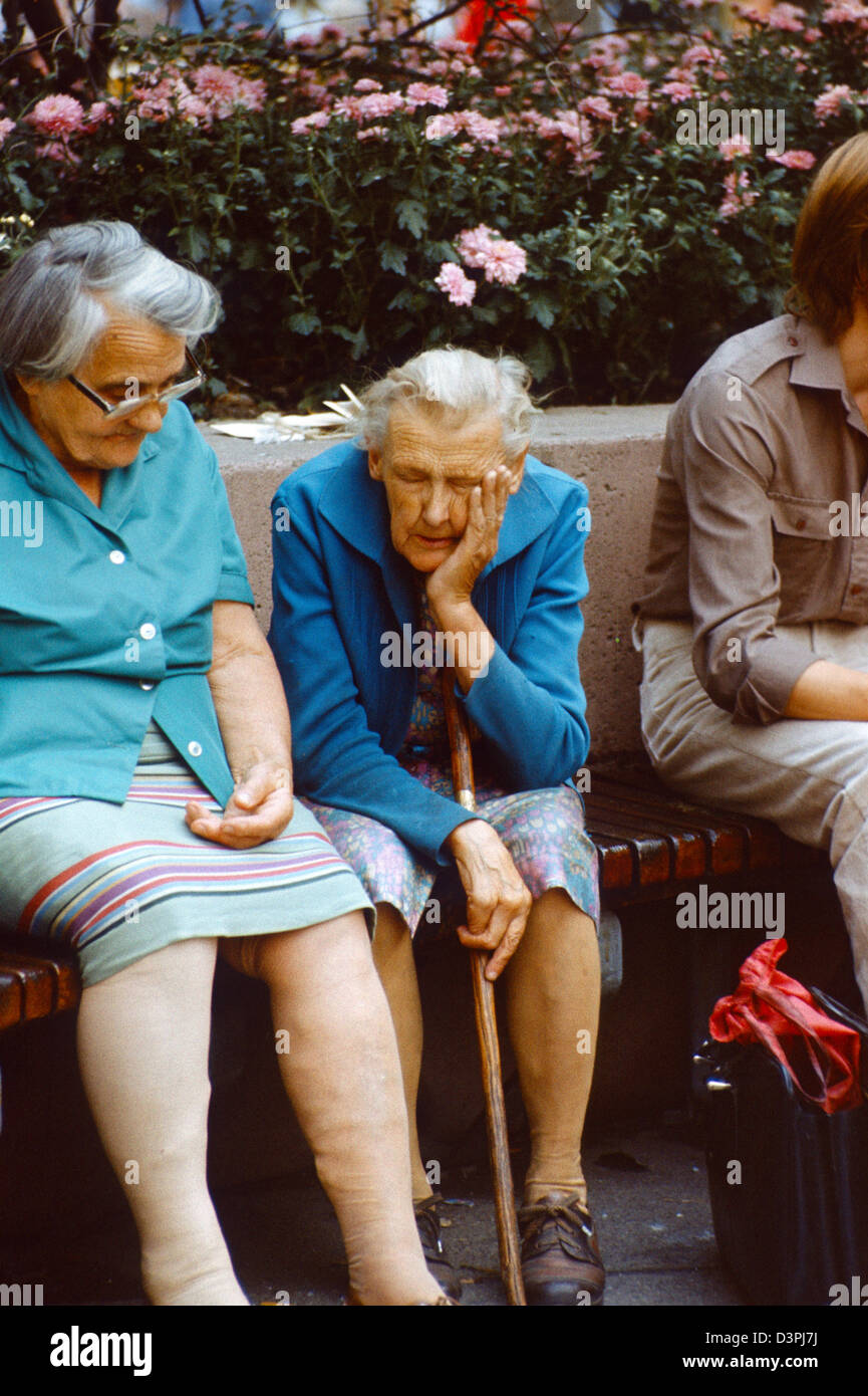 Berlin, GDR, senior citizen sitting on a bench with his eyes closed ...