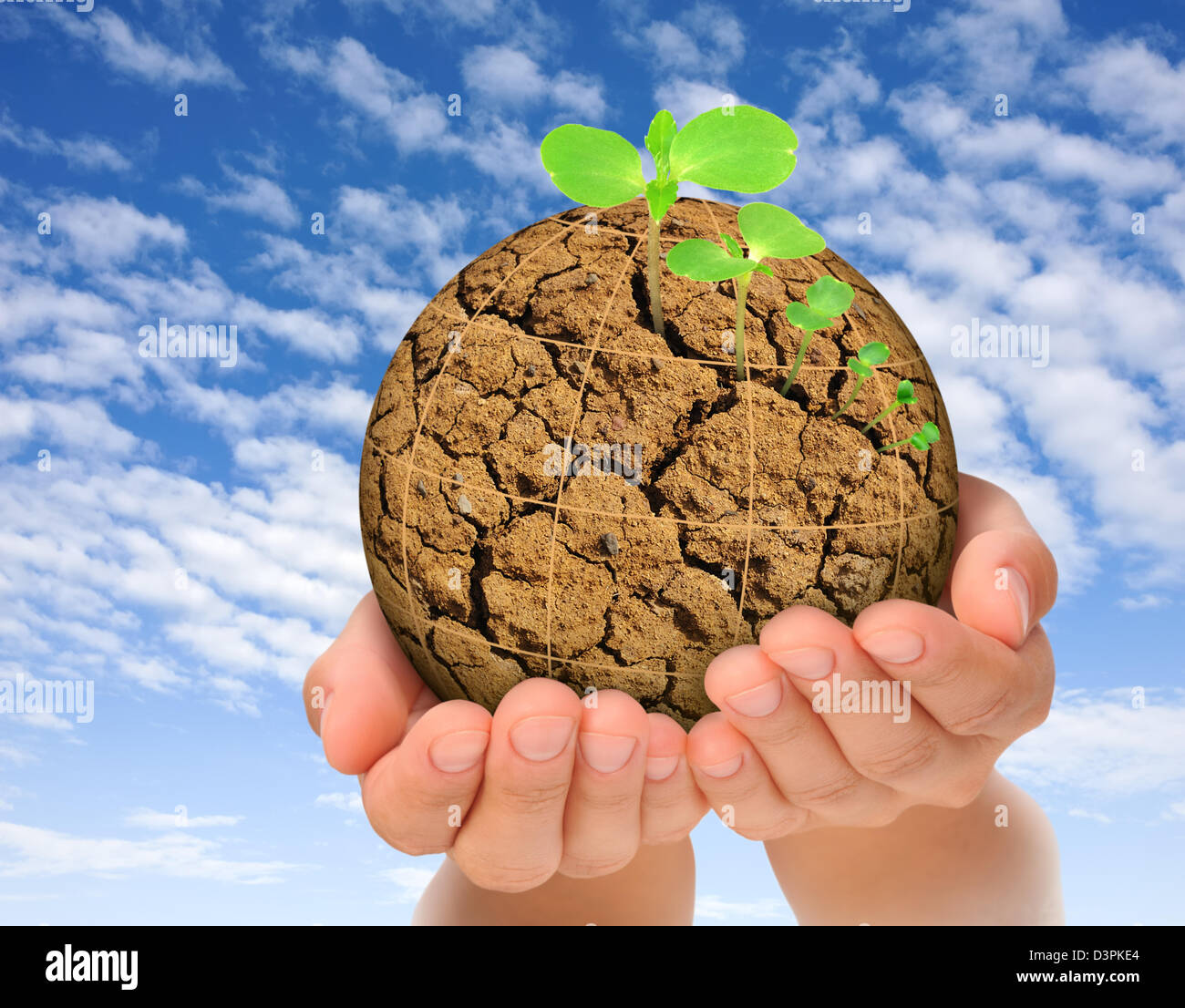 Plants growing out of parched planet in hands, evolution concept Stock ...