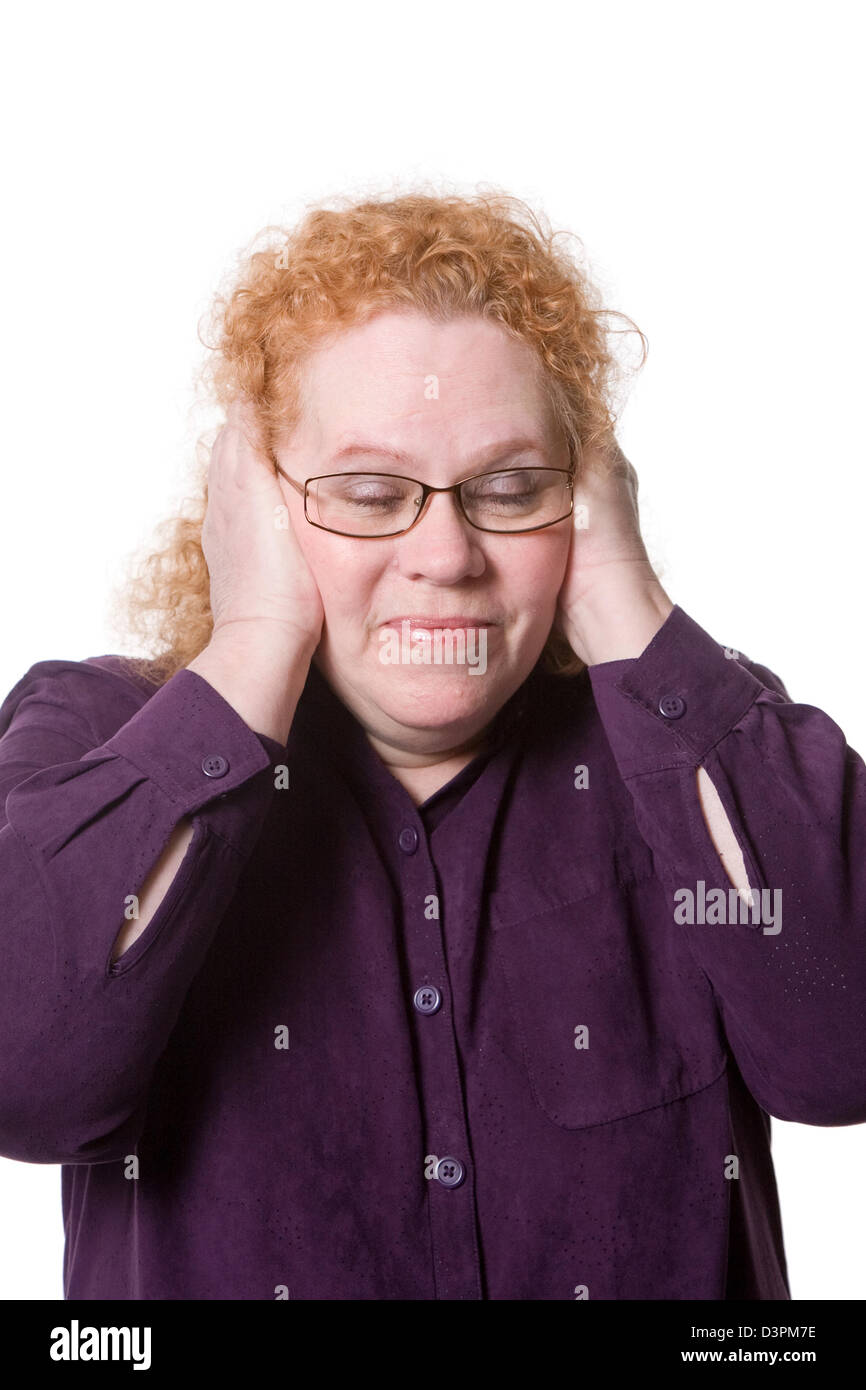 Woman covering her ears Stock Photo - Alamy