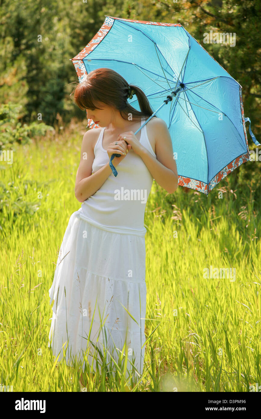 Young woman up in the Colorado mountains on a beautiful summer day ...