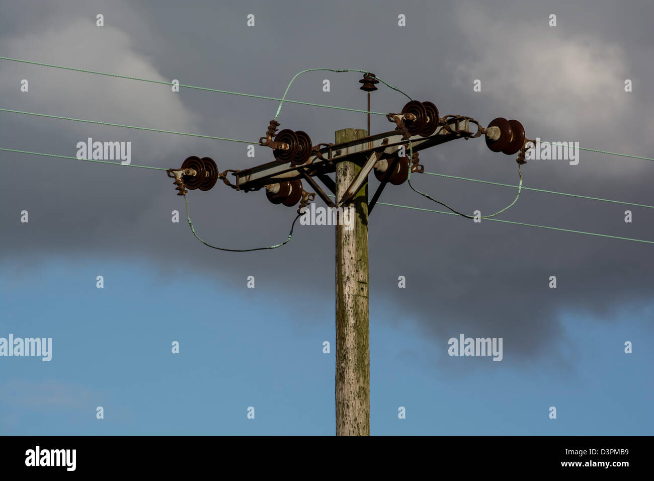 Old pylon carrying power to mankind Stock Photo - Alamy