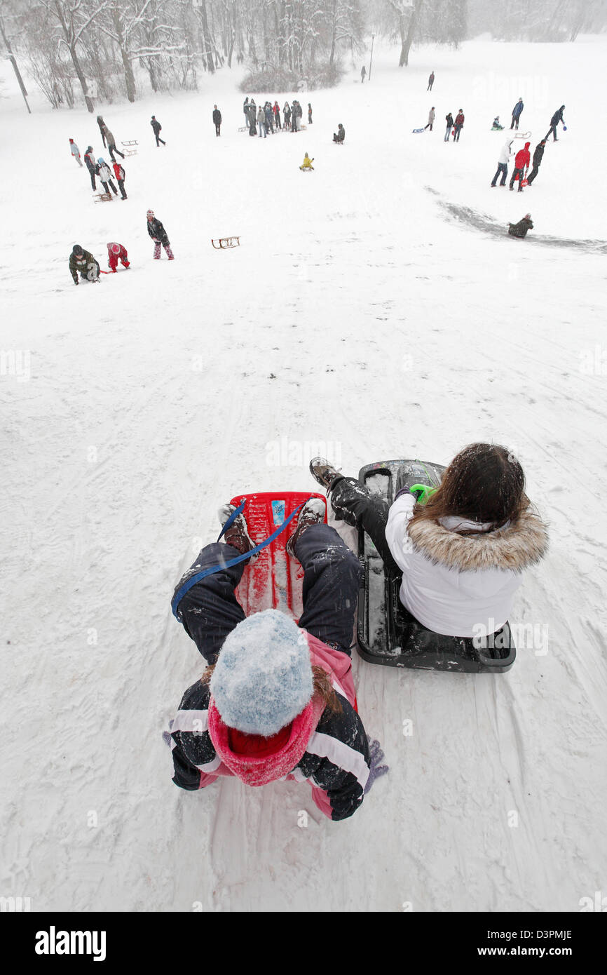 Leipzig, Germany, said two children sledding hill with sleds on the ...