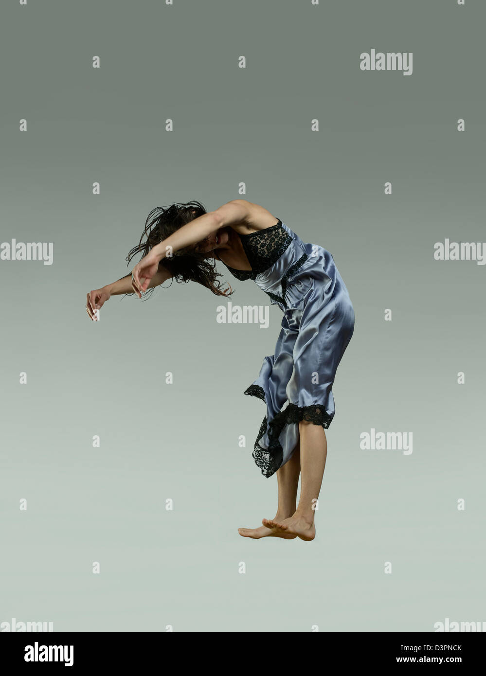 Humans floating frozen in mid air Stock Photo - Alamy