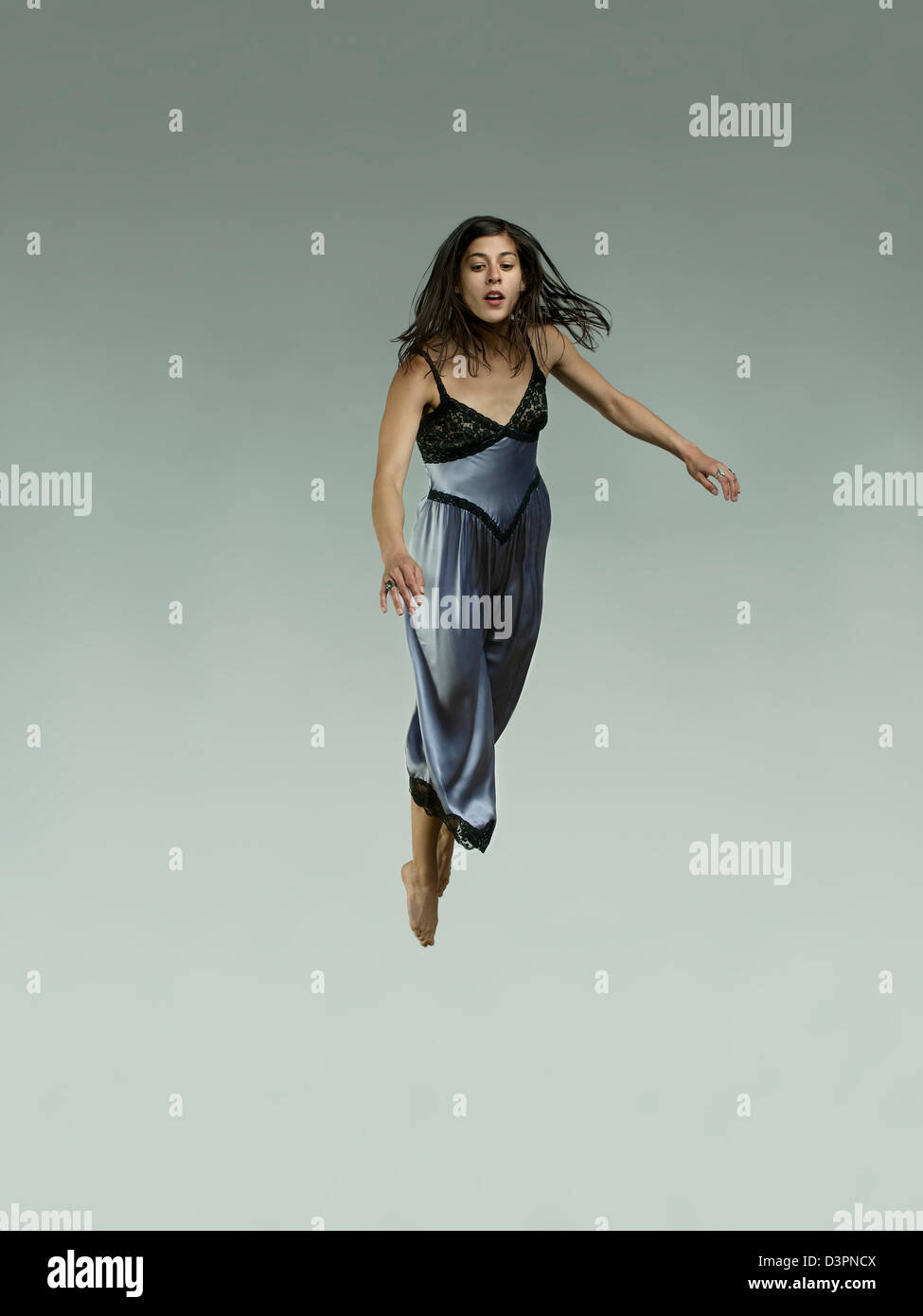 Humans floating frozen in mid air Stock Photo - Alamy