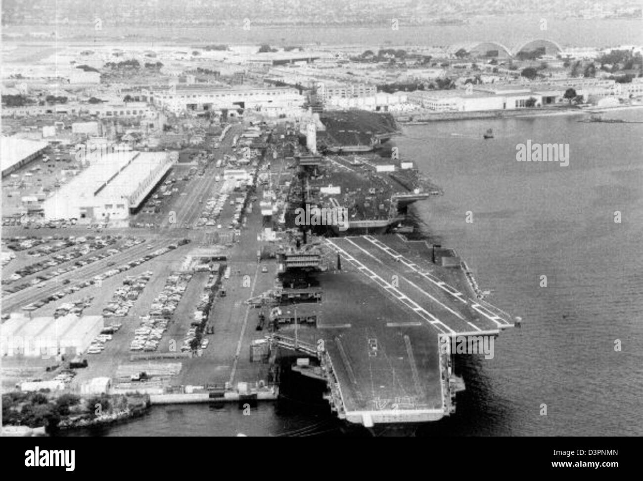This image captures three aircraft carriers undergoing repairs at North ...