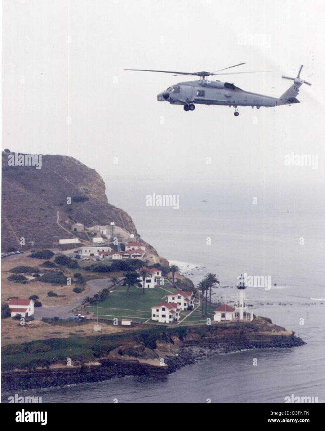 An image showing an SH-60B helicopter from HSL 49 flying over Point ...
