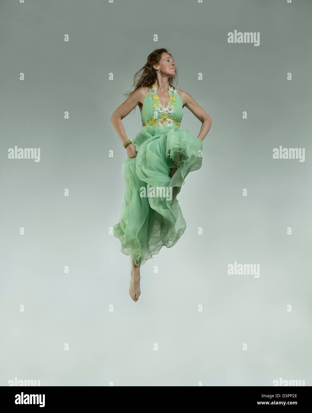 Humans floating frozen in mid air Stock Photo - Alamy