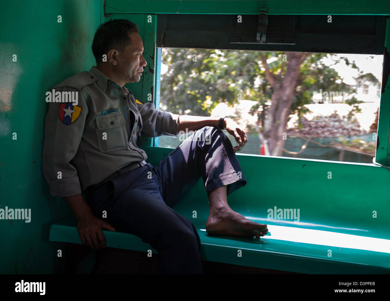 Police man on the Circular Train commuter rail Yangon Myanmar Stock ...