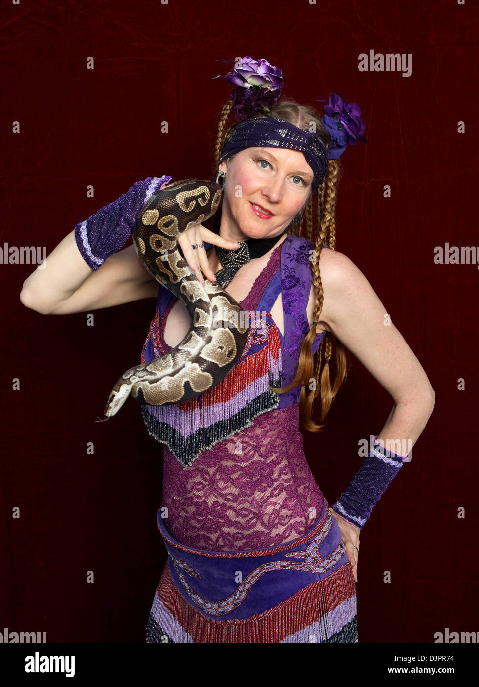 Portrait of a woman holding a snake Stock Photo - Alamy
