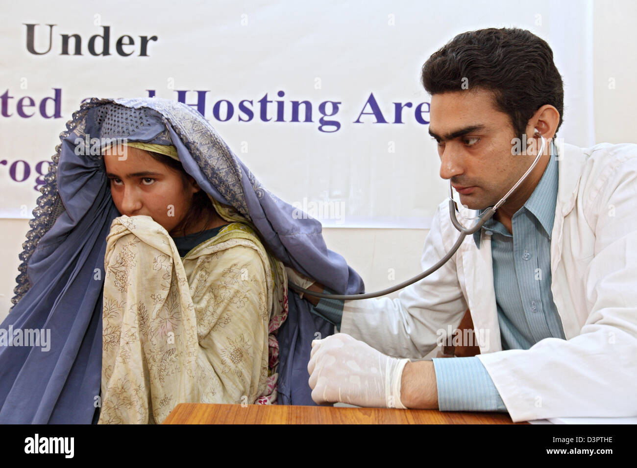 Peshawar, Pakistan, a doctor examines a patient of St. John Stock Photo ...
