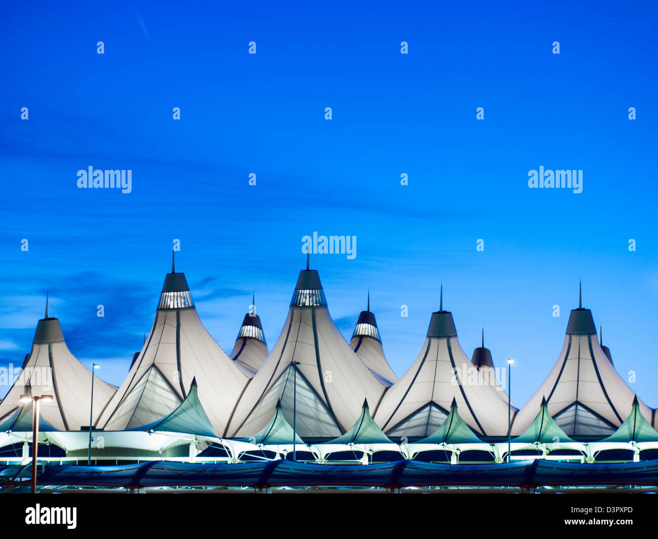 Glowing tents of DIA at sunrise. Denver International Airport well ...