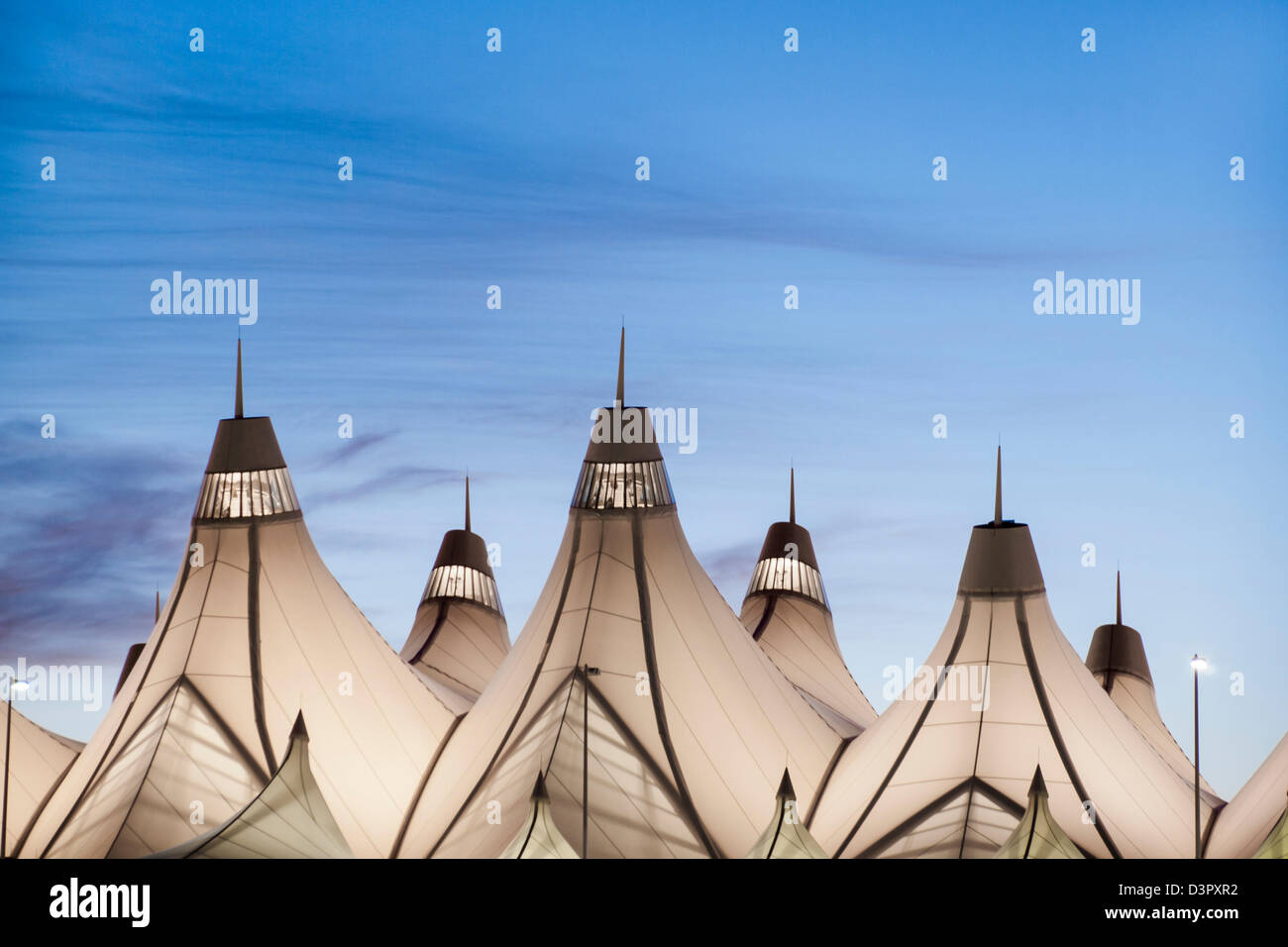 Glowing tents of DIA at sunrise. Denver International Airport well ...