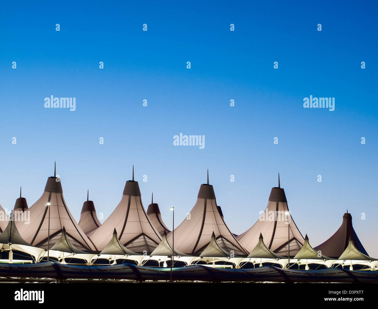 Glowing tents of DIA at sunrise. Denver International Airport well ...