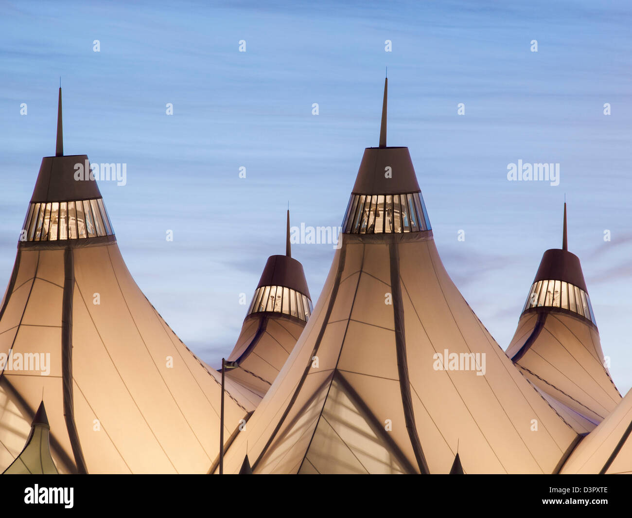 Glowing tents of DIA at sunrise. Denver International Airport well ...