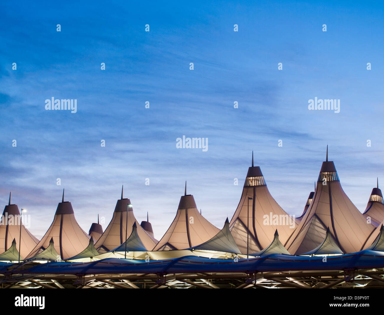 Glowing tents of DIA at sunrise. Denver International Airport well ...