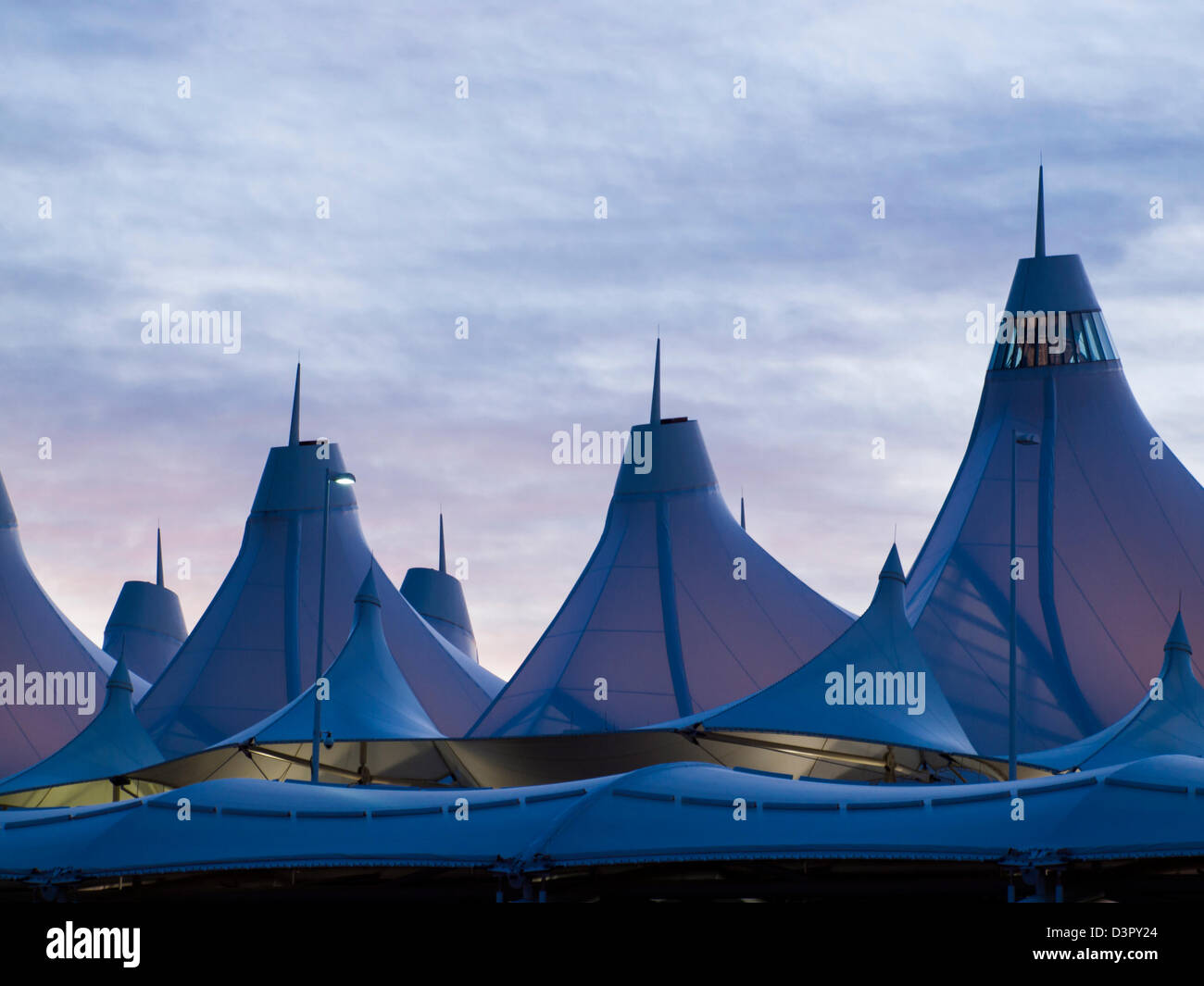 Glowing tents of DIA at sunrise. Denver International Airport well ...
