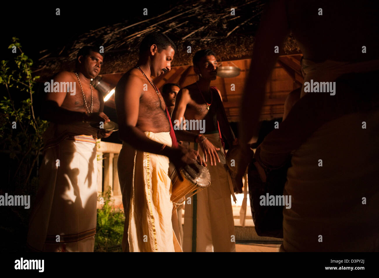 Group of people playing musical instrument during traditional festival ...